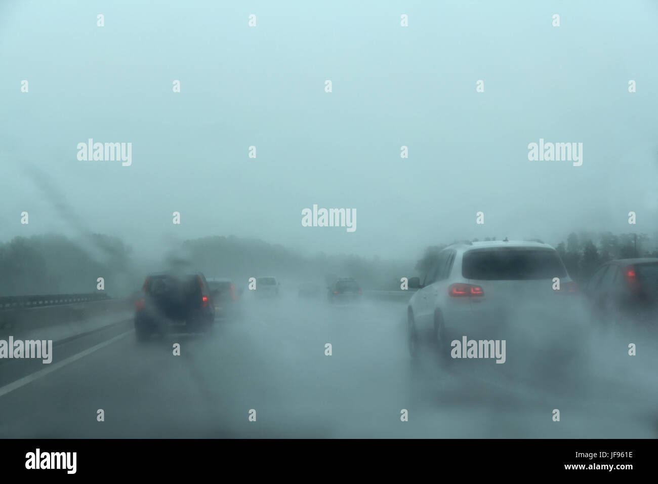 traffic on the freeway a rainy day Stock Photo - Alamy