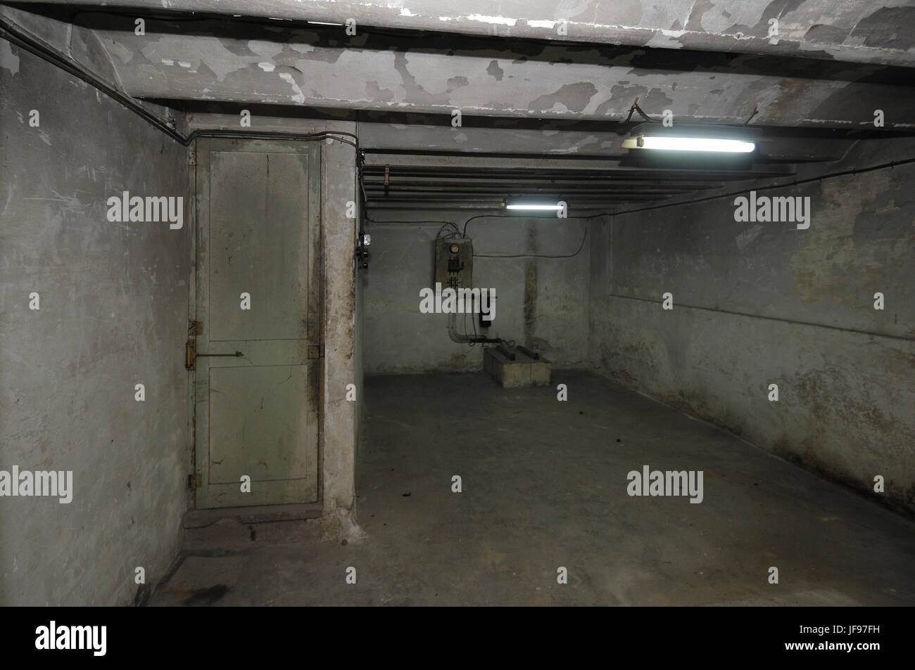 Old and outdated room in the basement of a house with electric ...