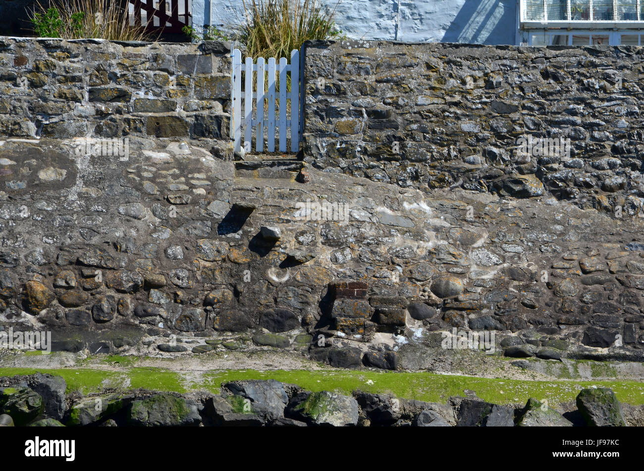 Stone steps up to a gate. Port William is a small fishing village in ...