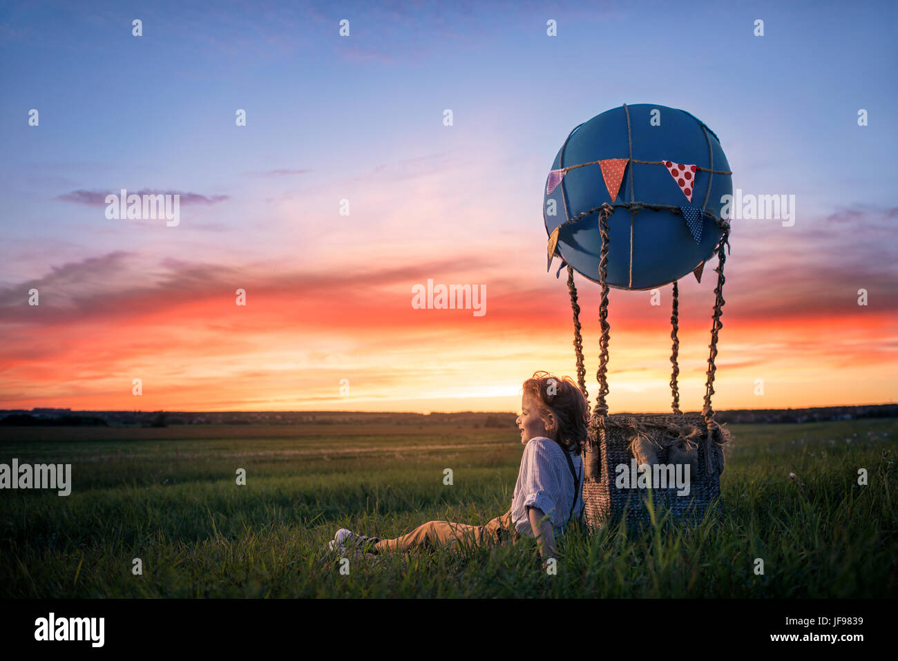 Boy at sunset Stock Photo - Alamy