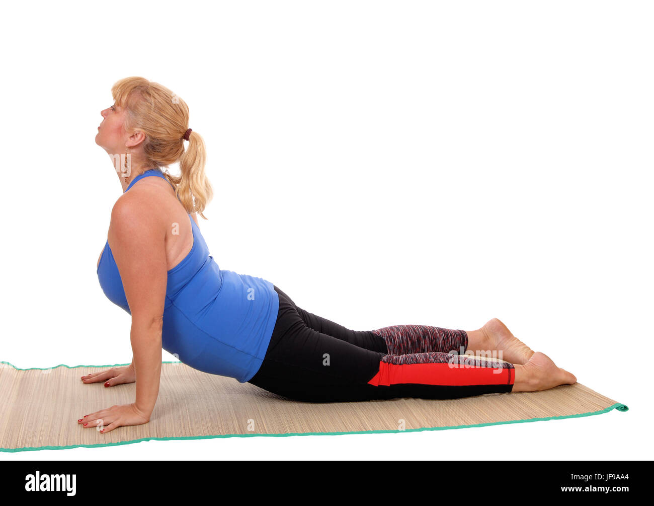 Yoga trainer showing stretching Stock Photo - Alamy
