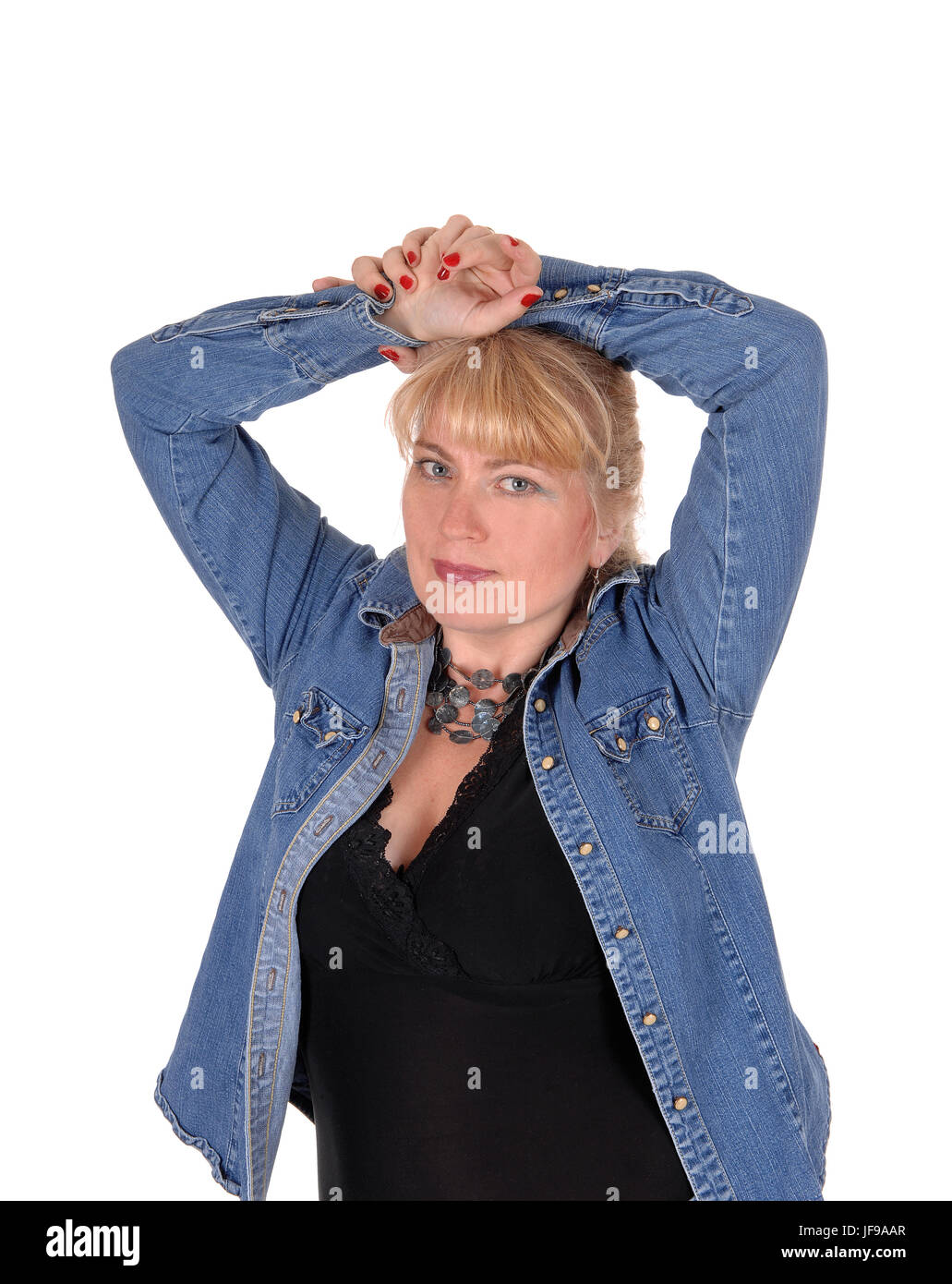 Woman with hands on head Stock Photo - Alamy