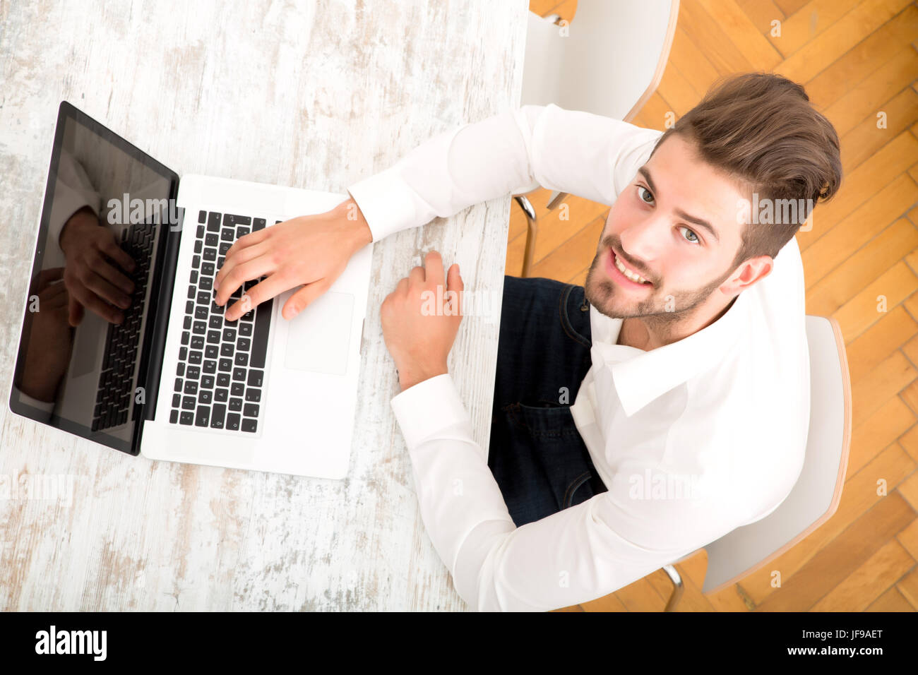 Young man with a laptop computer Stock Photo - Alamy
