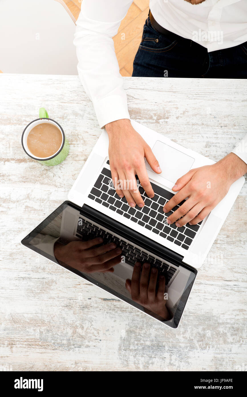 Young man with a laptop computer Stock Photo - Alamy