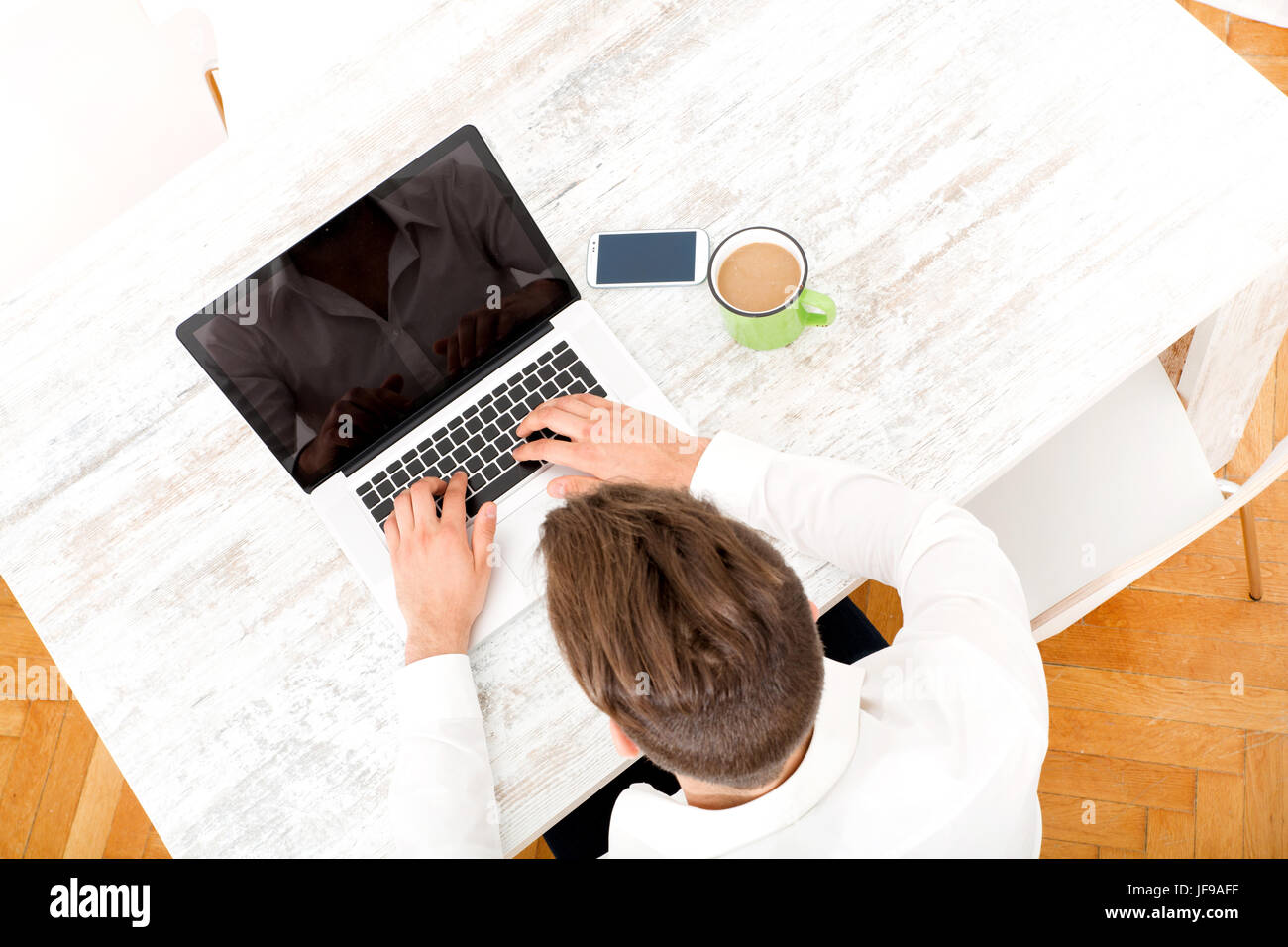 Young man with a laptop computer Stock Photo - Alamy