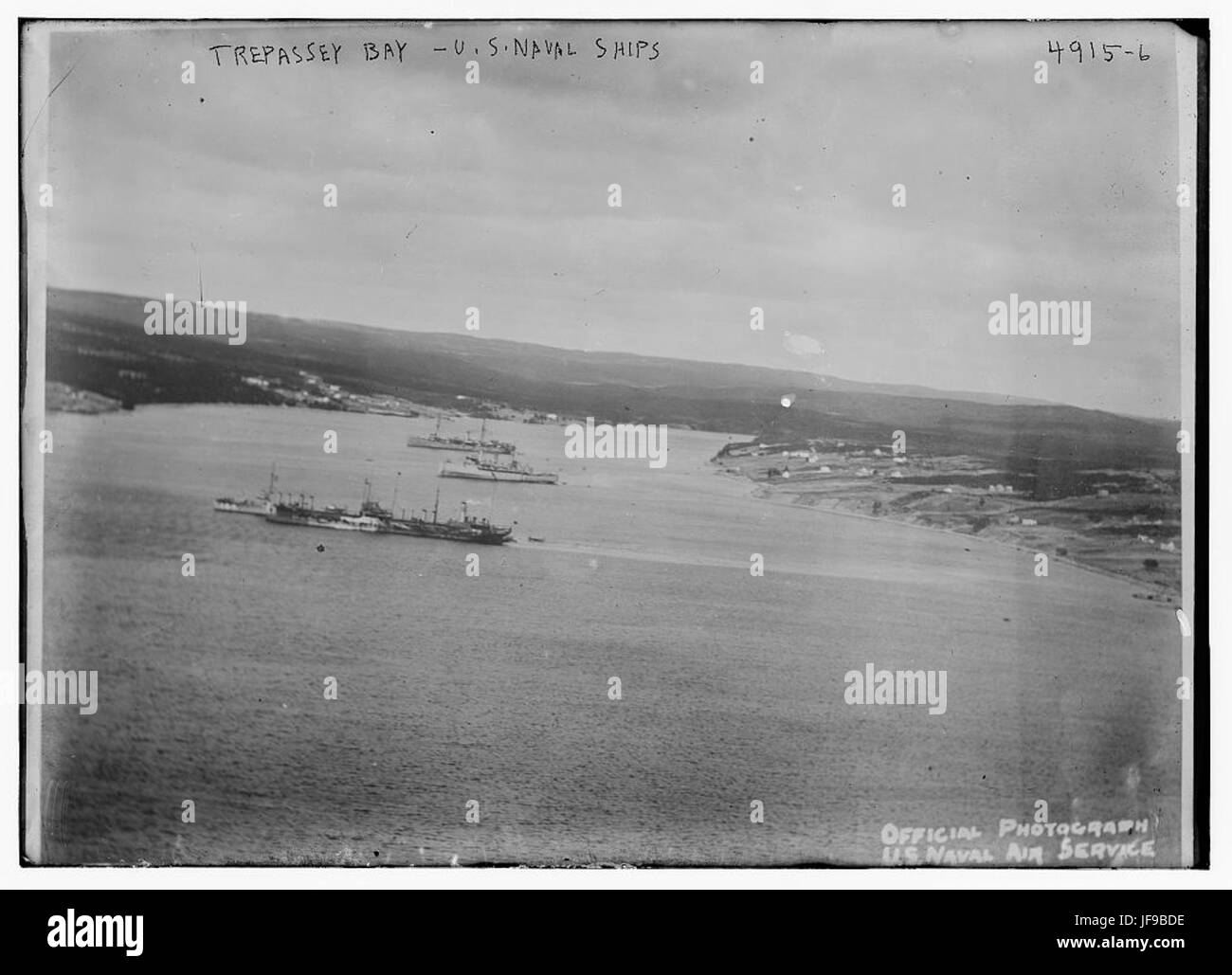 A vintage photograph of US naval ships at Trepassey Bay, capturing a ...