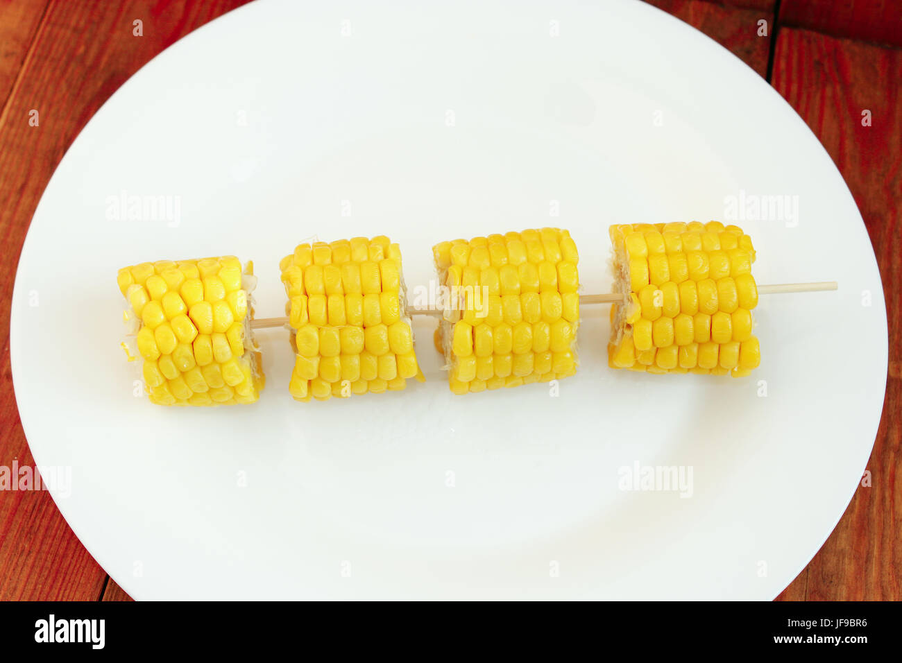 pieces of boiled corns on the plate Stock Photo - Alamy