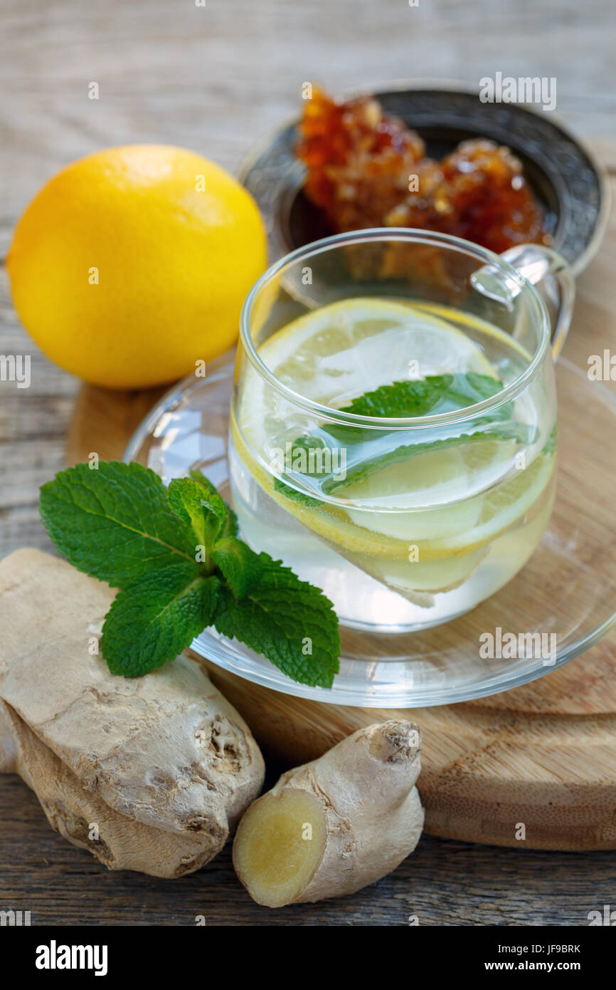 Hot drink with ginger, lemon, mint and honey Stock Photo - Alamy