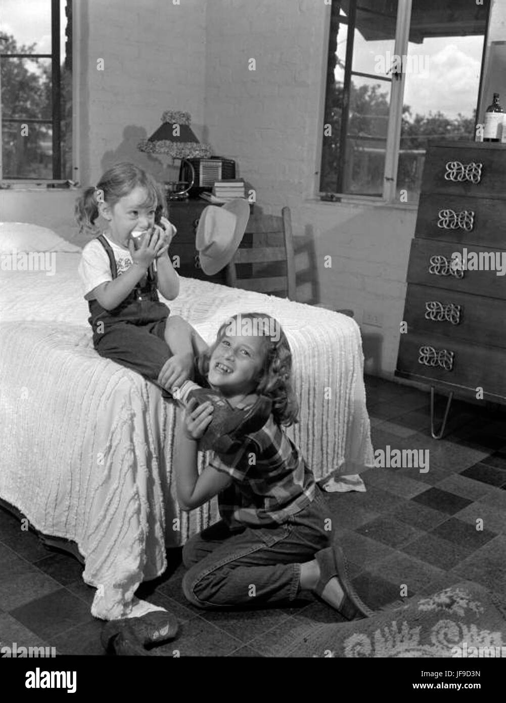 Judy Partin assists her sister Kathy with her boots in this endearing ...