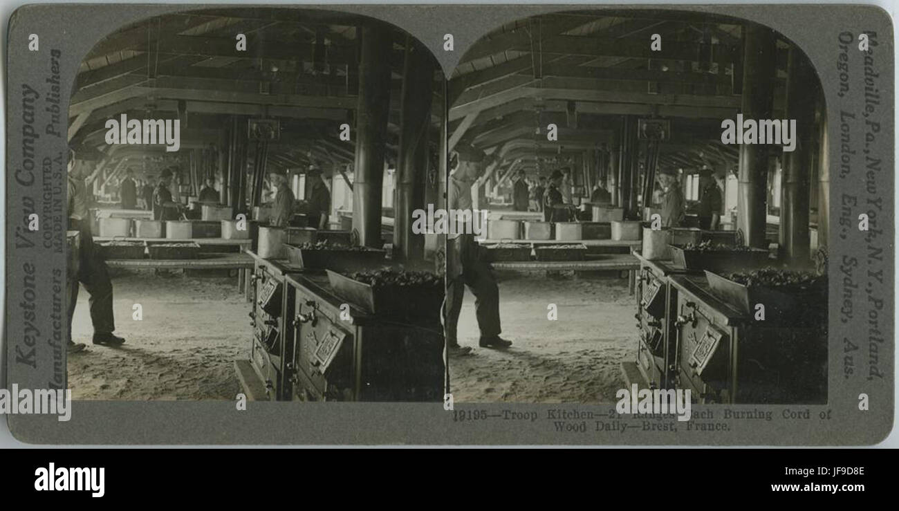 A wartime scene from World War I showing a troop kitchen with 21 stoves ...