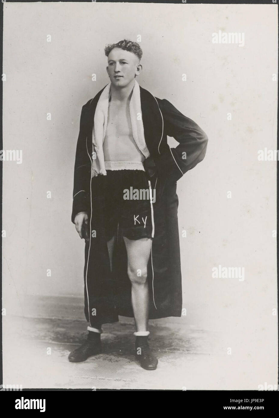 A vintage portrait of boxer Kid Young (Leo White) dressed in a boxing ...