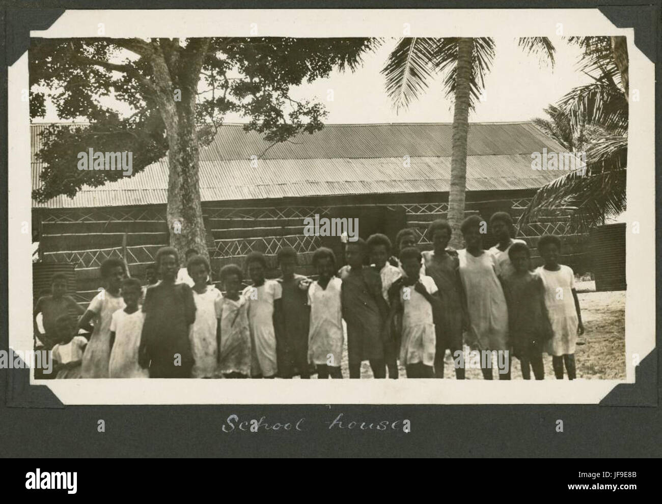 Group of school children stand out the front of the Stock Photo - Alamy