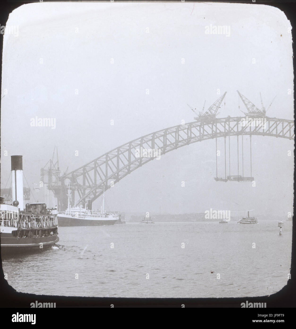 A historical photograph showing the construction of the iconic Sydney ...