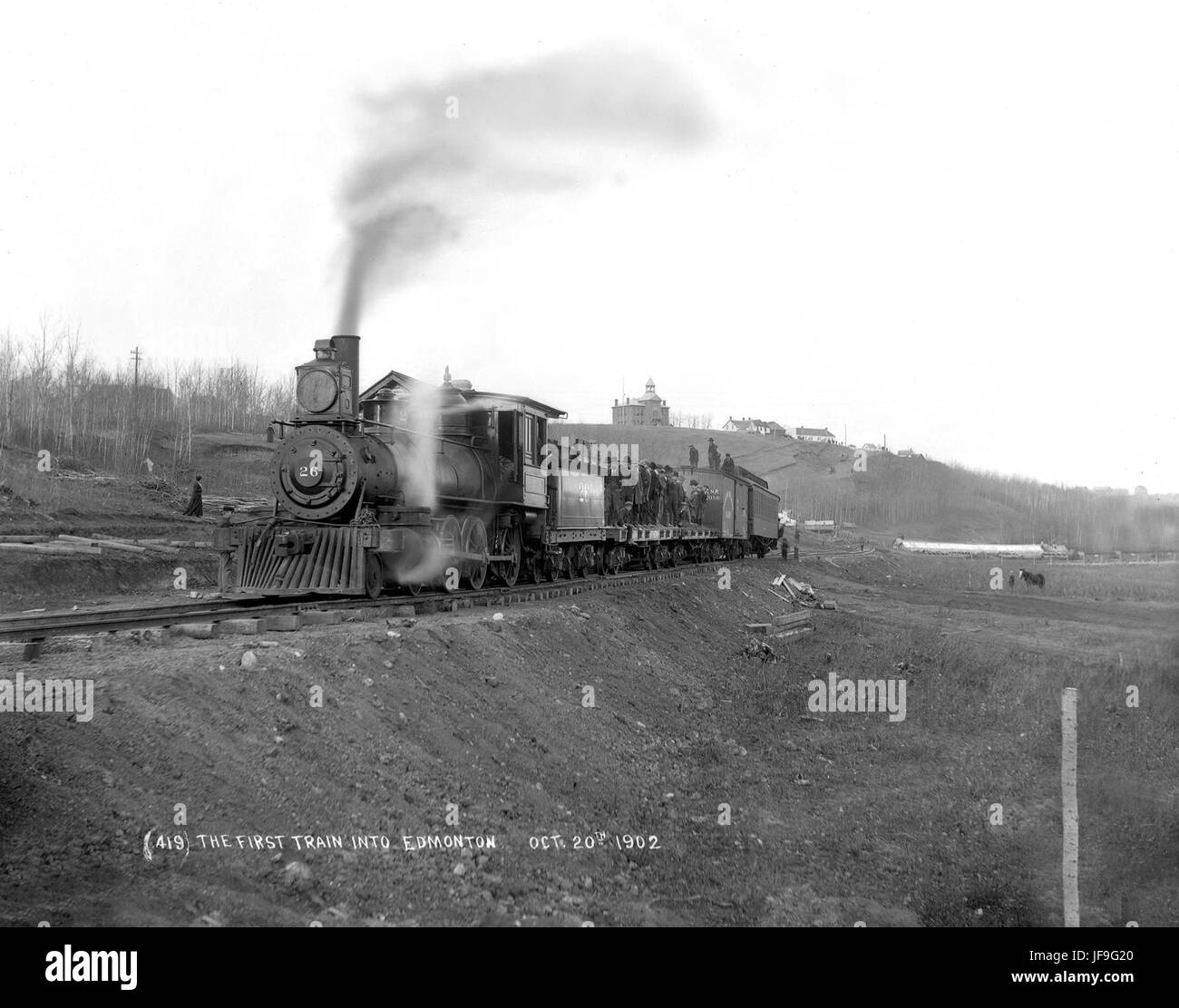 A historical photo capturing the arrival of the first train into ...
