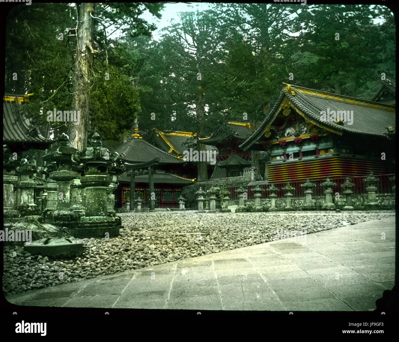 A group of historical buildings set amidst trees with an ornamental ...