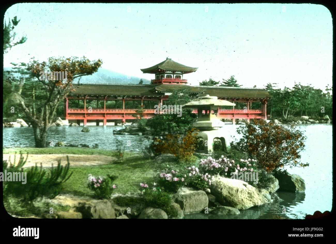 A long red wooden covered bridge from Japan's Meiji period, showcasing ...