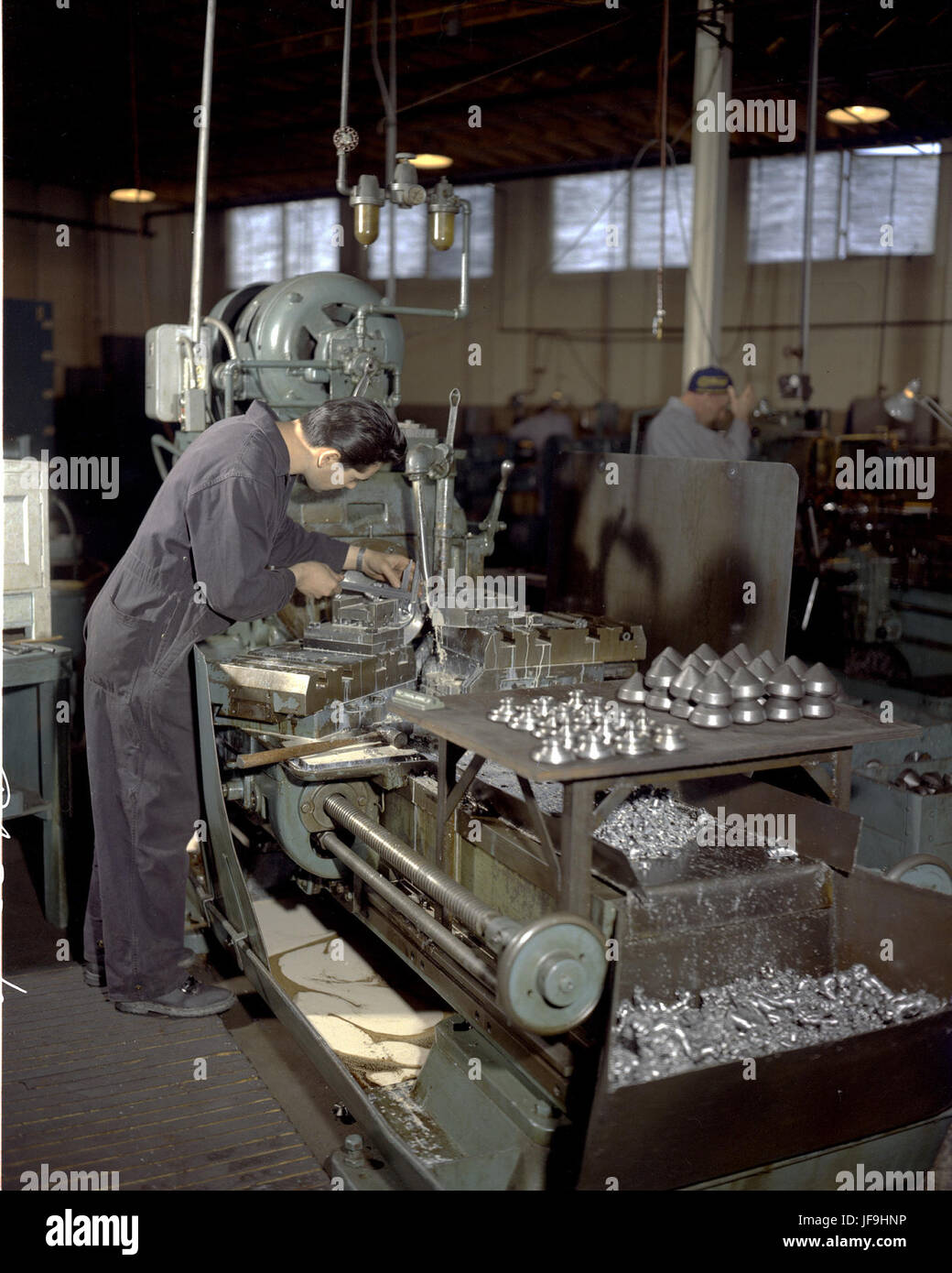 A machinist working at the Canada Oil Tool Manufacturing company in ...