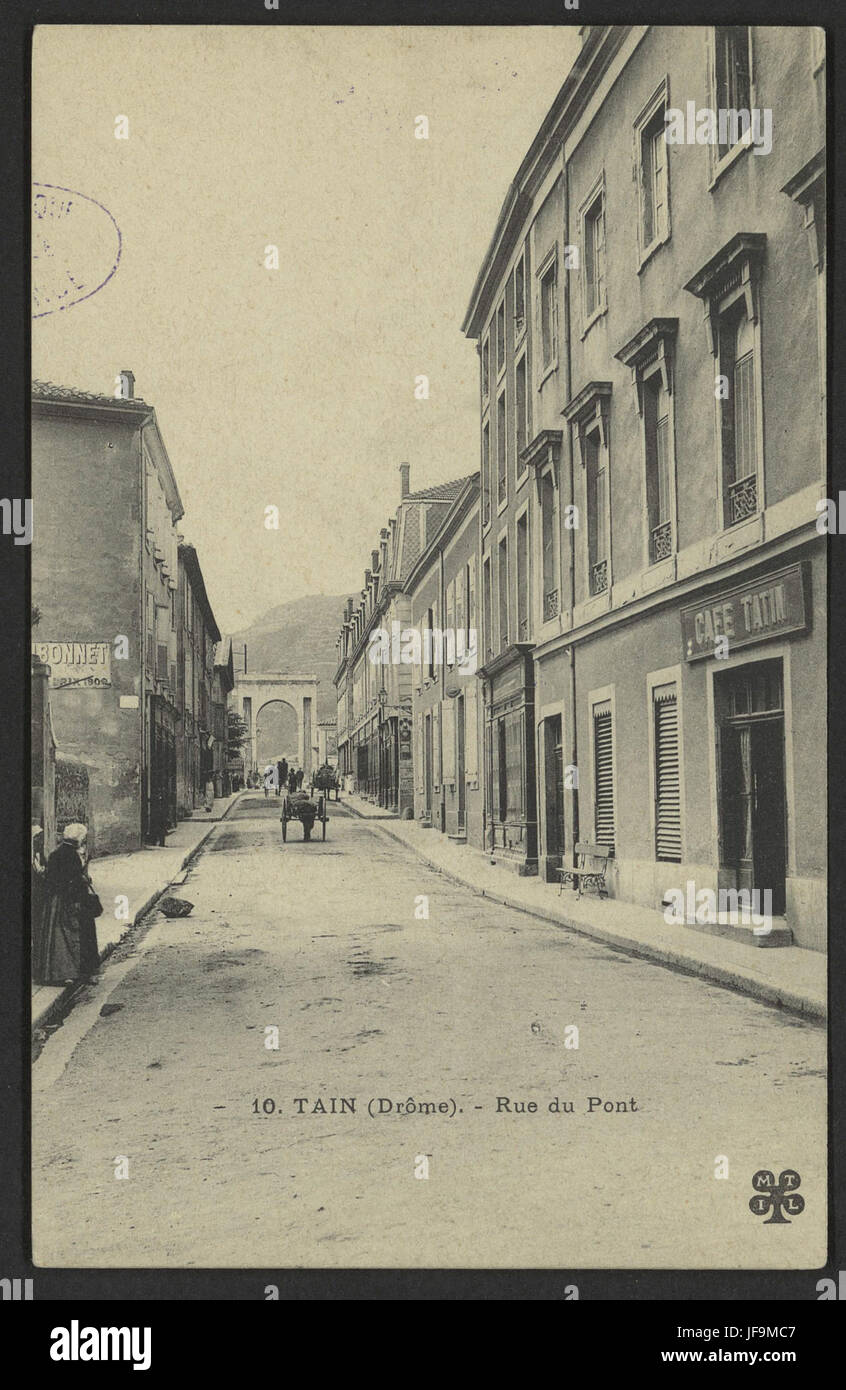 A historic view of Rue du Pont in Tain, Drôme, a picturesque town in ...