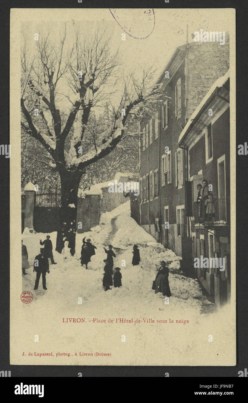 Livron, France, Place de l'Hôtel de Ville covered in snow, offering a ...