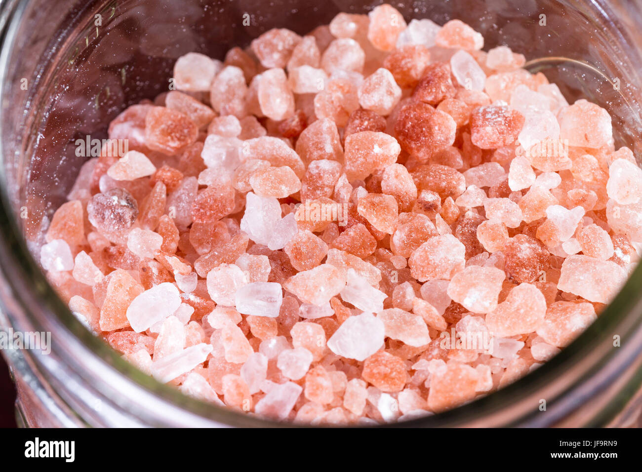 Himalayan pink salt crystals in different shapes and sizes and varying ...