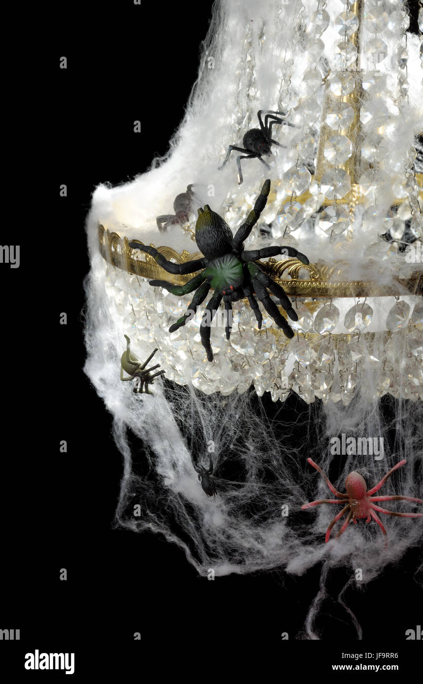 Spiders on the chandelier a tangled web of a decoration for Halloween ...