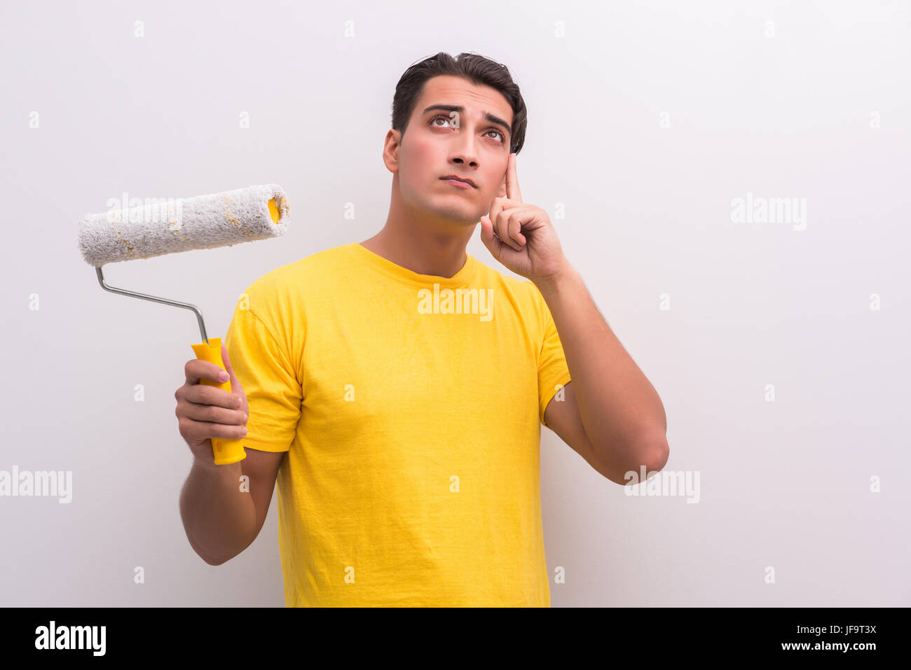 Man painting house in DIY concept Stock Photo - Alamy