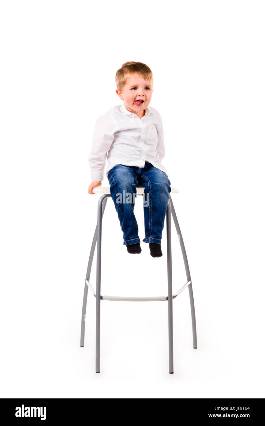 Child boy sitting stool hi-res stock photography and images - Alamy