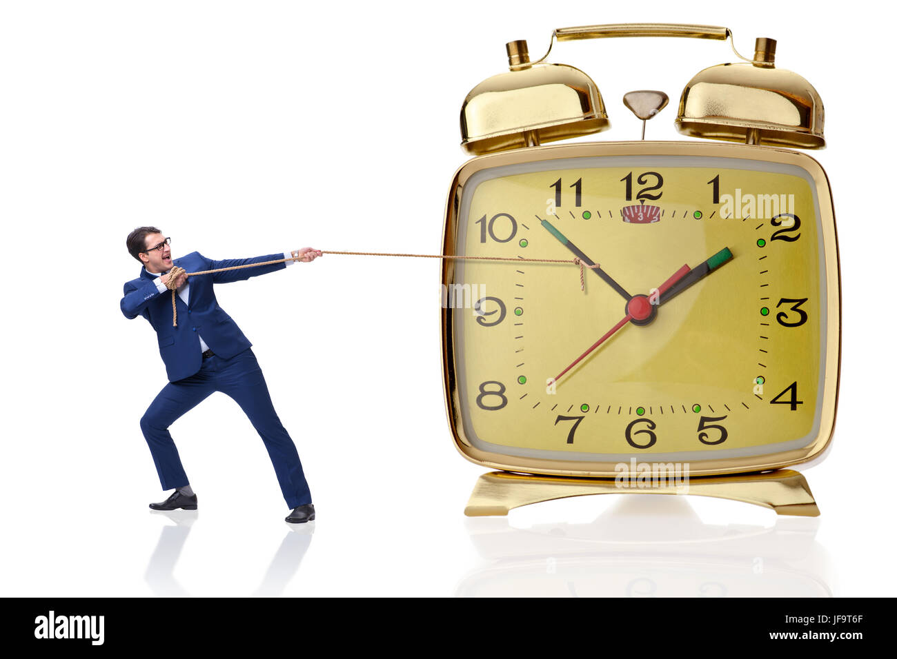 Businessman pulling clock in time concept Stock Photo - Alamy