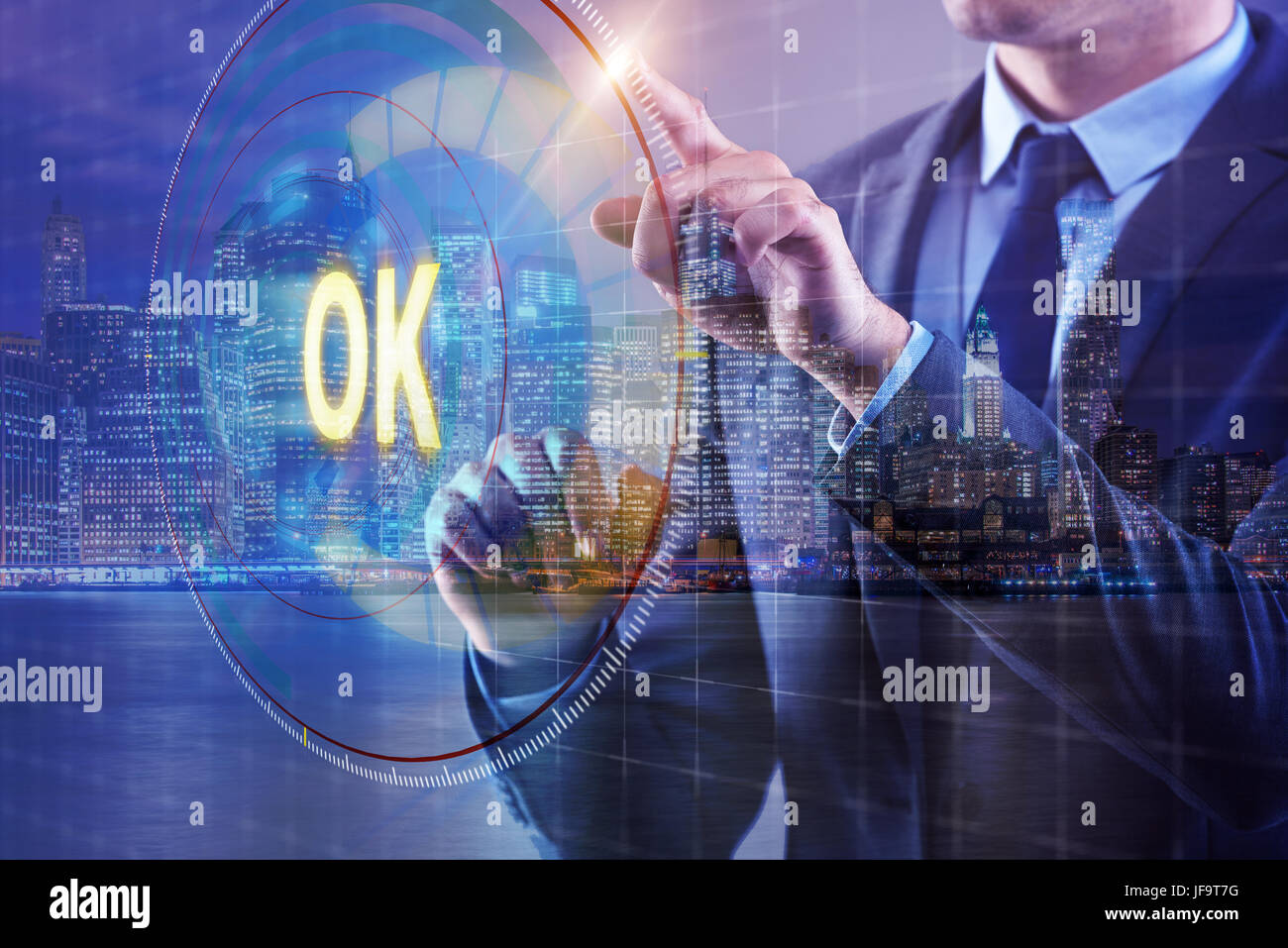 Businessman pressing virtual button OK Stock Photo - Alamy