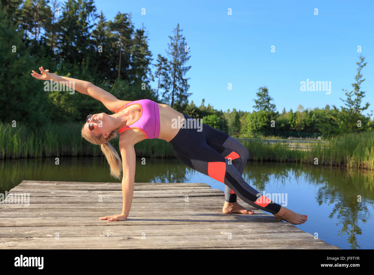 A sporty woman is taking a cigarette break Stock Photo - Alamy