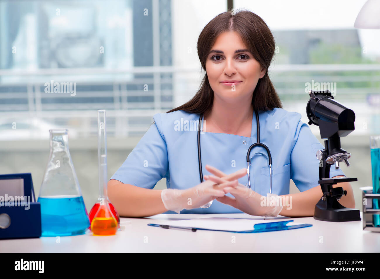Young woman working in the laboratory Stock Photo - Alamy