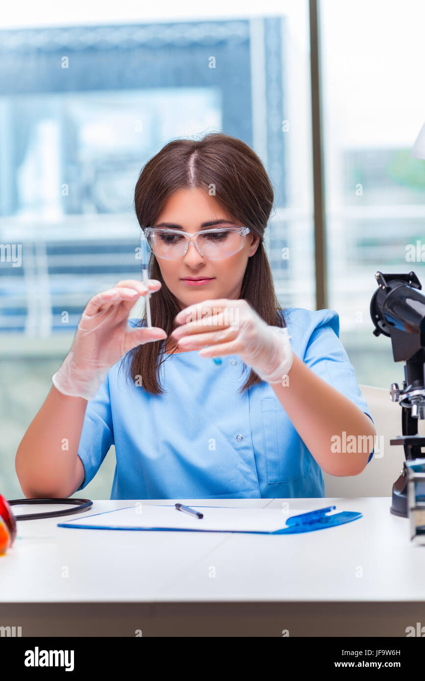 Young woman working in the laboratory Stock Photo - Alamy