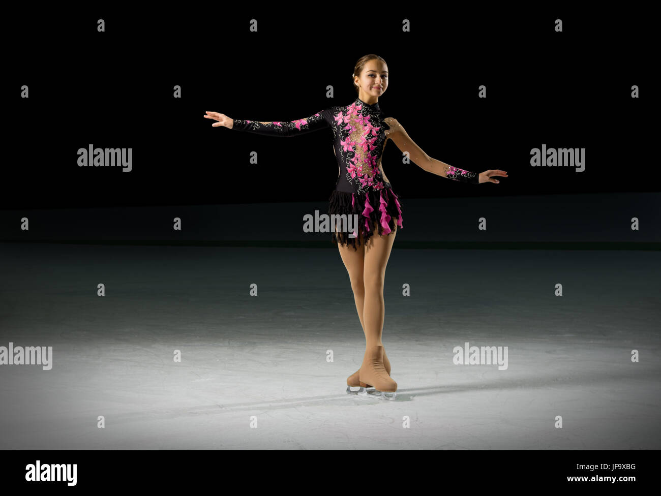 Young girl figure skater (on ice arena ver Stock Photo - Alamy