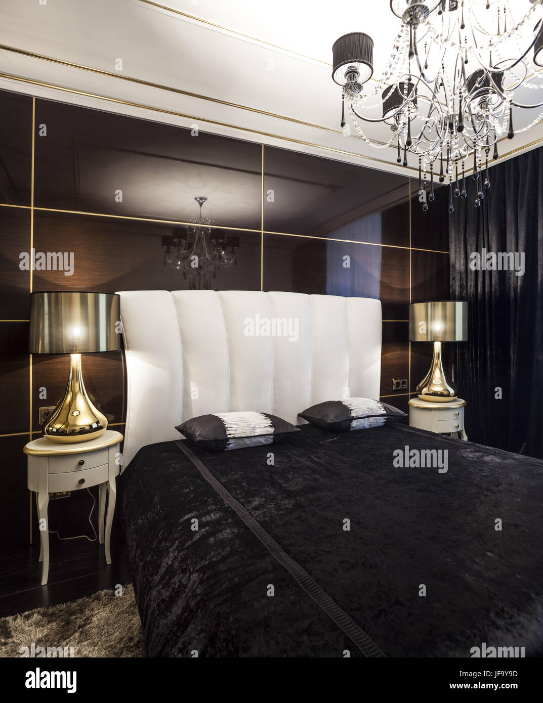 Luxury bedroom interior with golden lights Stock Photo - Alamy