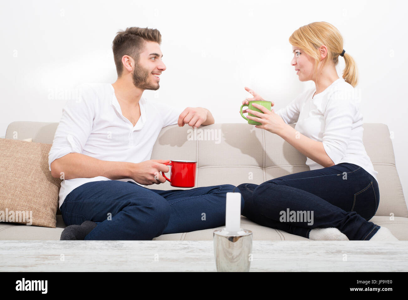 Couple flirting on sofa hi-res stock photography and images - Alamy