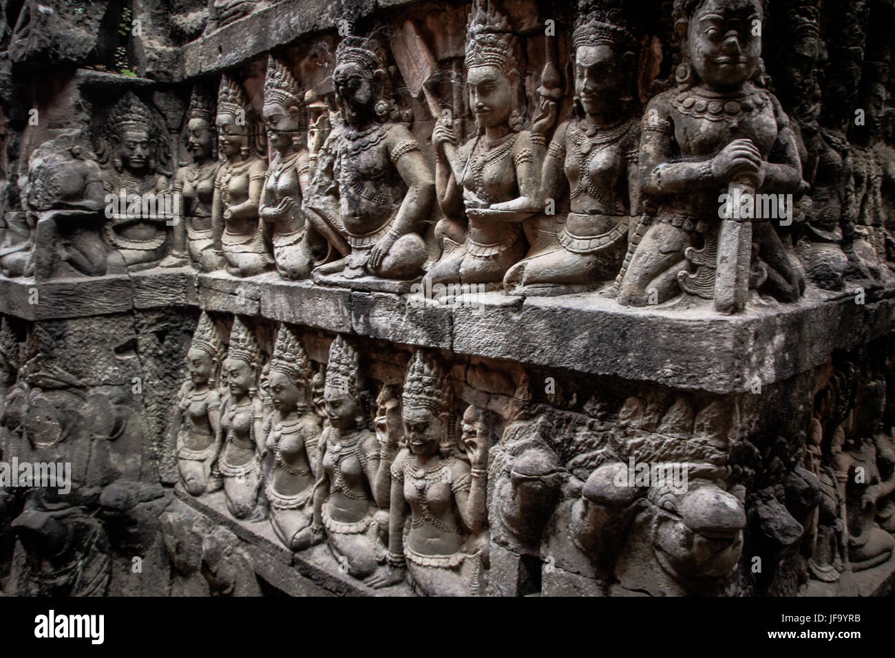 Wall with people in angkor wat, cambodia Stock Photo - Alamy