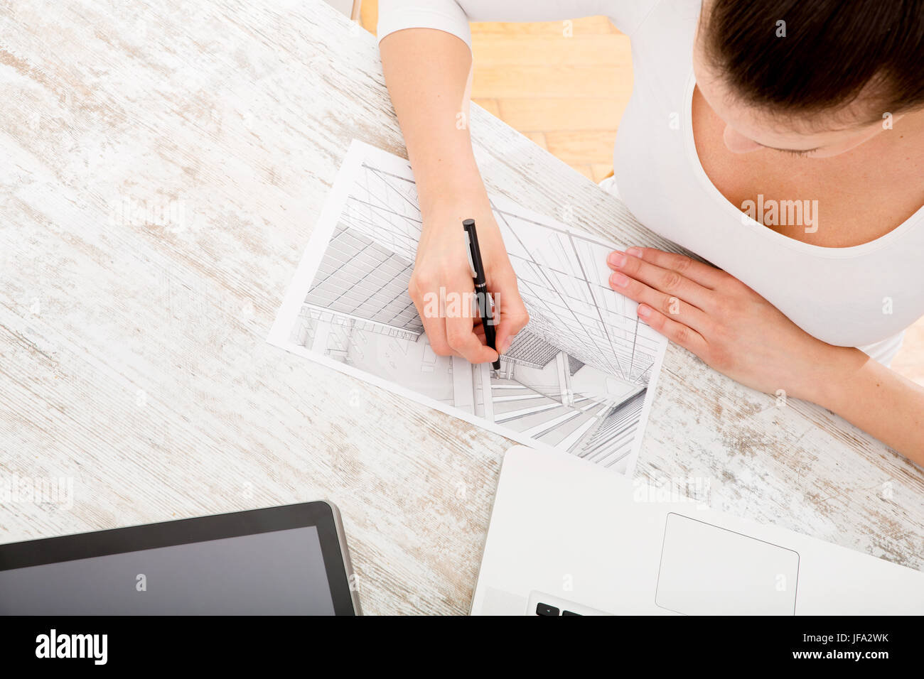 Woman drawing a blueprint Stock Photo - Alamy