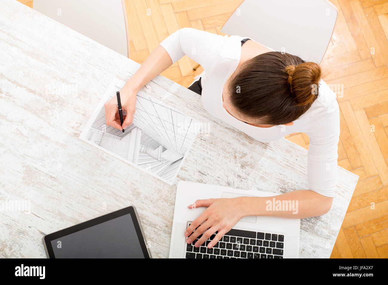 Woman drawing a blueprint Stock Photo - Alamy