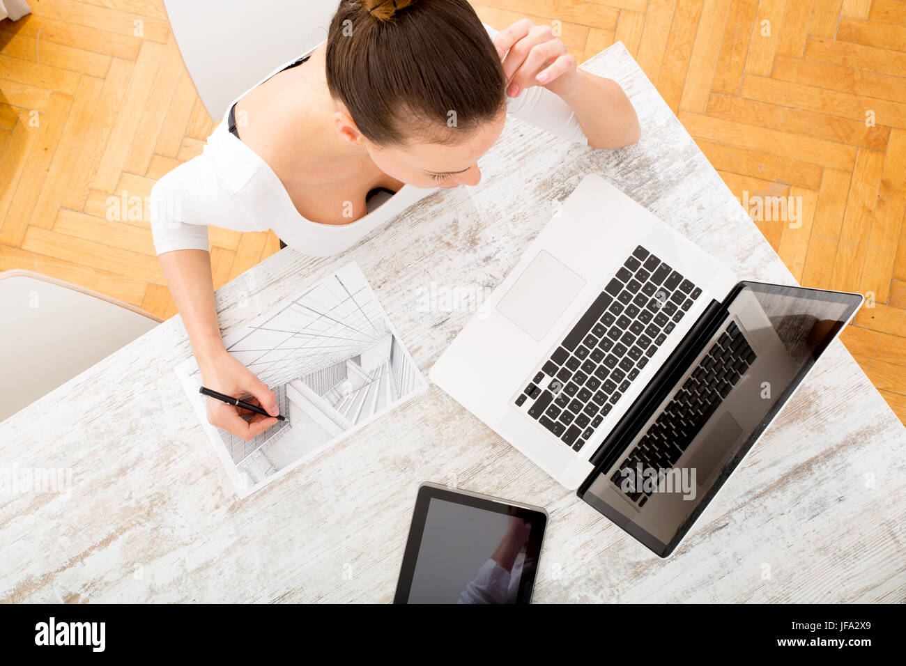 Woman drawing a blueprint Stock Photo - Alamy