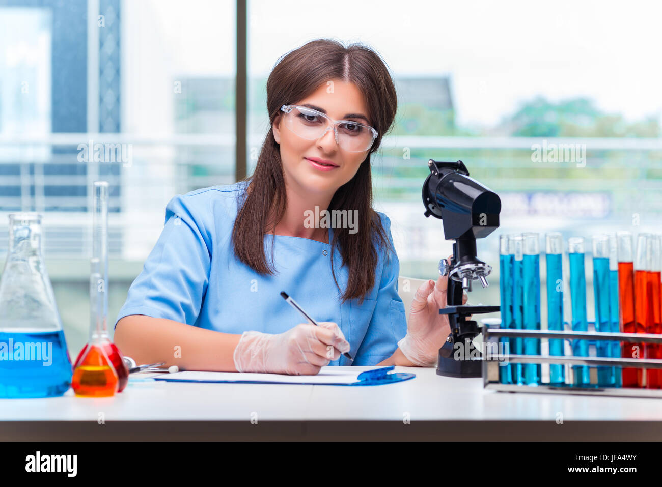 Young woman working in the laboratory Stock Photo - Alamy