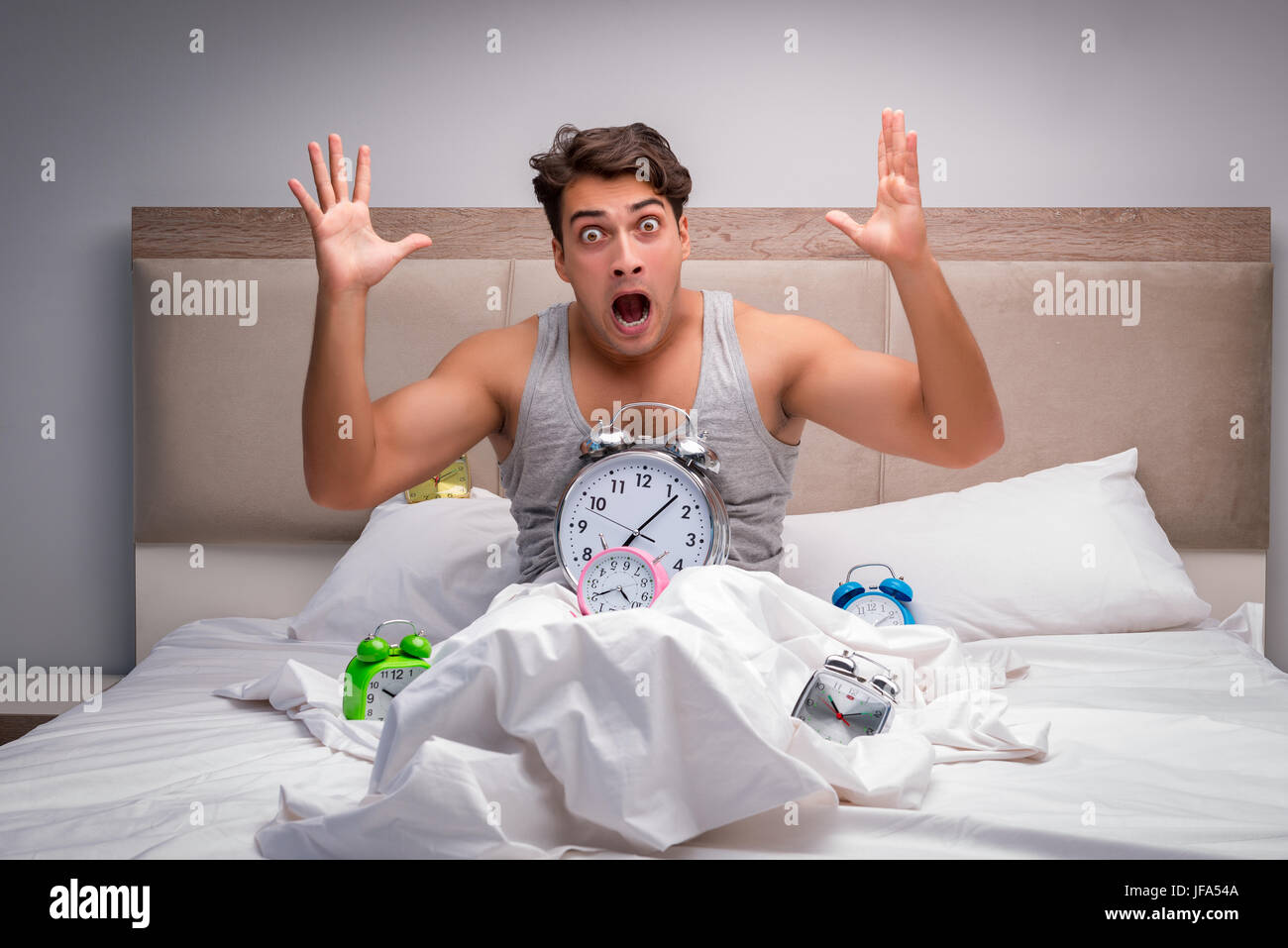 Man having trouble waking up in the morning Stock Photo - Alamy