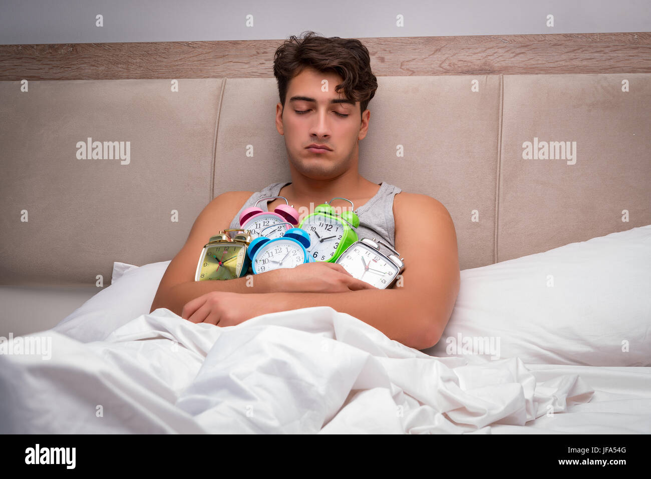 Man having trouble waking up in the morning Stock Photo - Alamy