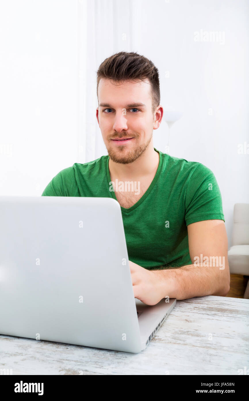 Young man working in the office Stock Photo - Alamy