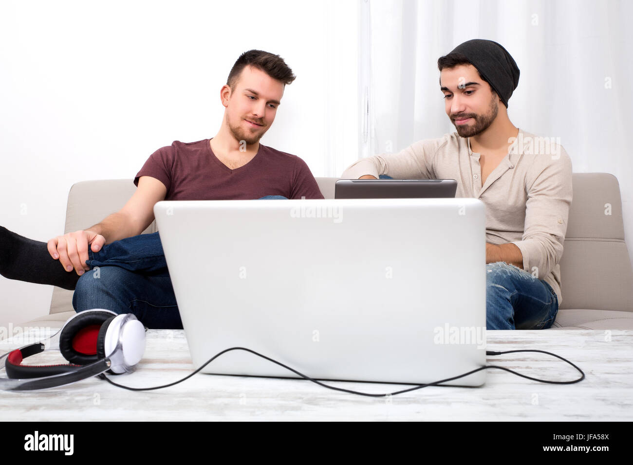 Two men talk sofa not female hi-res stock photography and images - Alamy