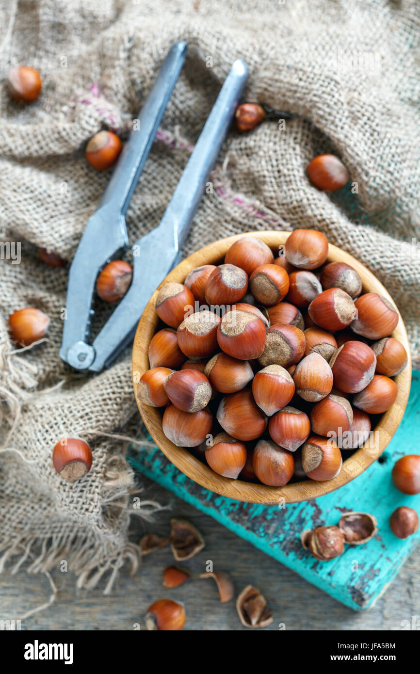 Nutcracker and a bowl with hazelnuts Stock Photo - Alamy