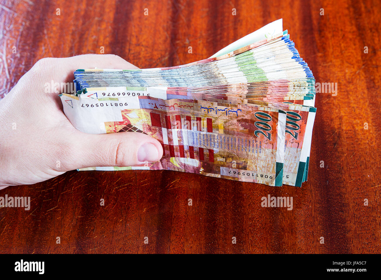 Hundred shekels bills hi-res stock photography and images - Alamy