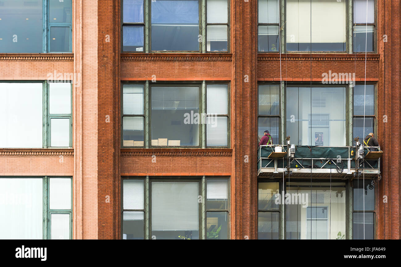 Workers washing windows Stock Photo - Alamy