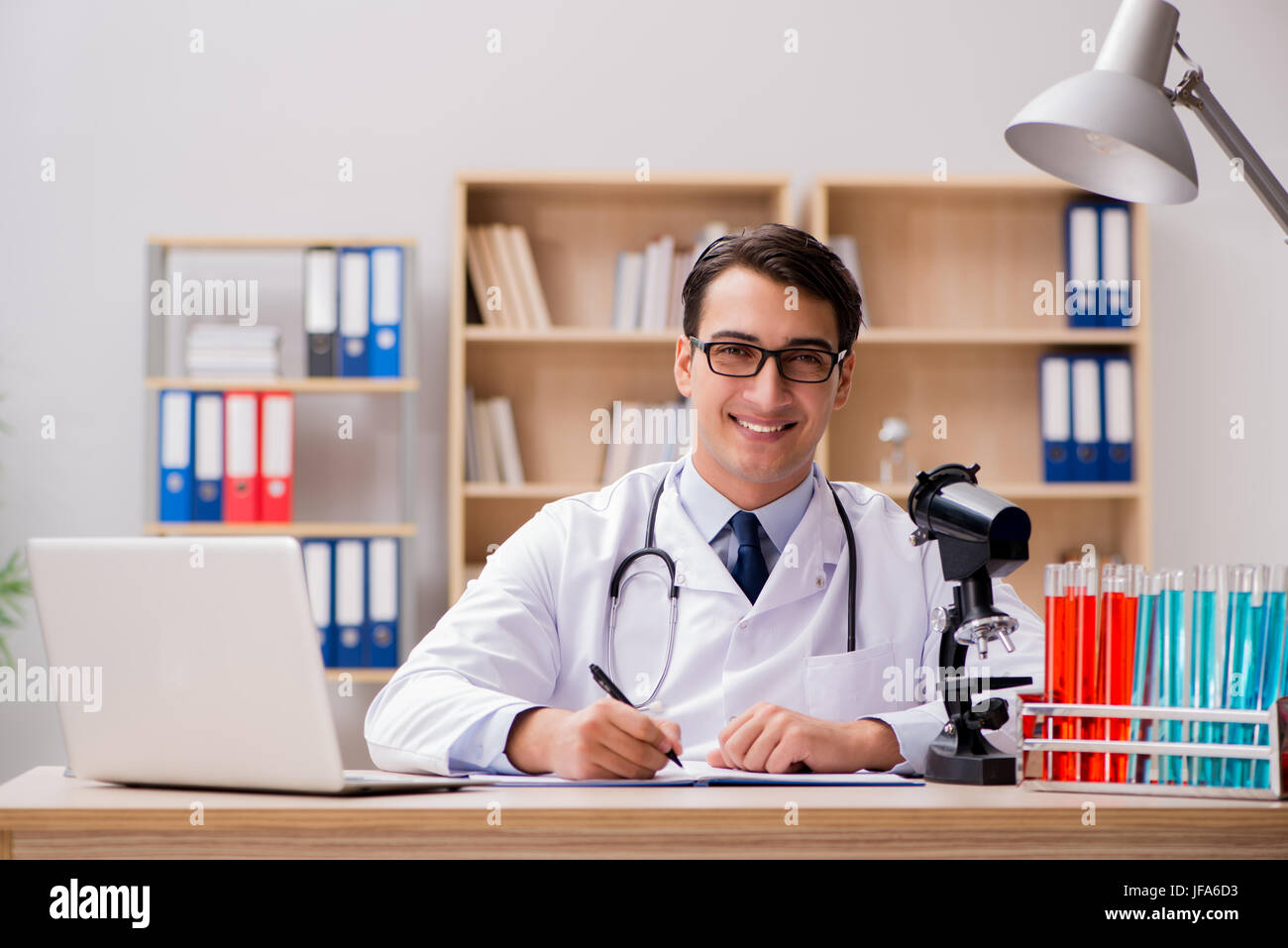 Man doctor working in the lab Stock Photo - Alamy