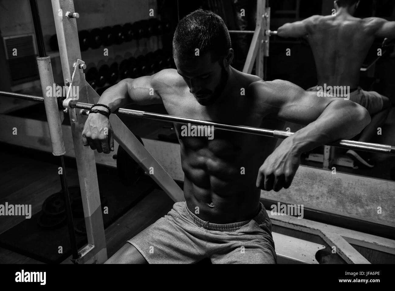 Good Looking And Attractive Young Athlete With Muscular Body Sitting On ...