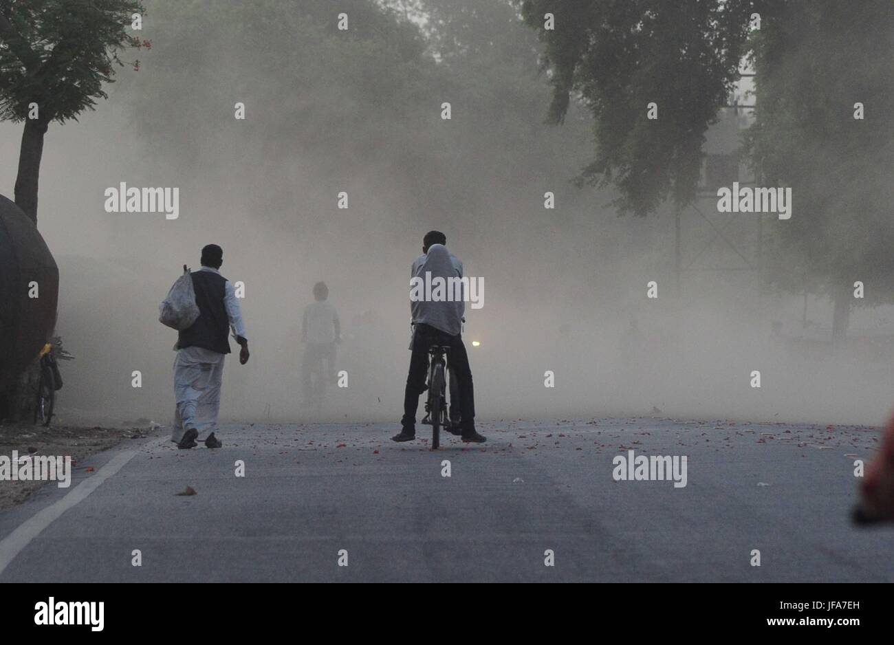 Allahabad, India. 29th June, 2017. People walks trough dust storm in ...